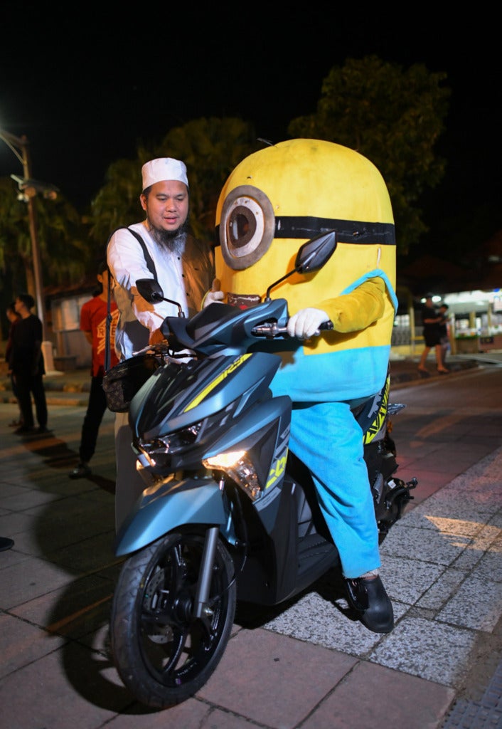 Ustaz Ebit Lew Gifts Motorbike to a 19yo Who Dresses as a Minion To ...