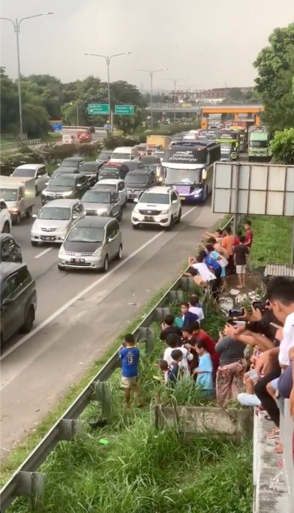 Indonesian Kids Waiting by Roadside Dance in Joy After Hearing Bus ...