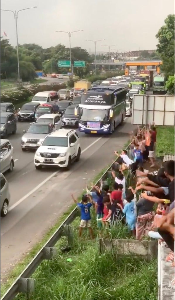 Indonesian Kids Waiting by Roadside Dance in Joy After Hearing Bus ...