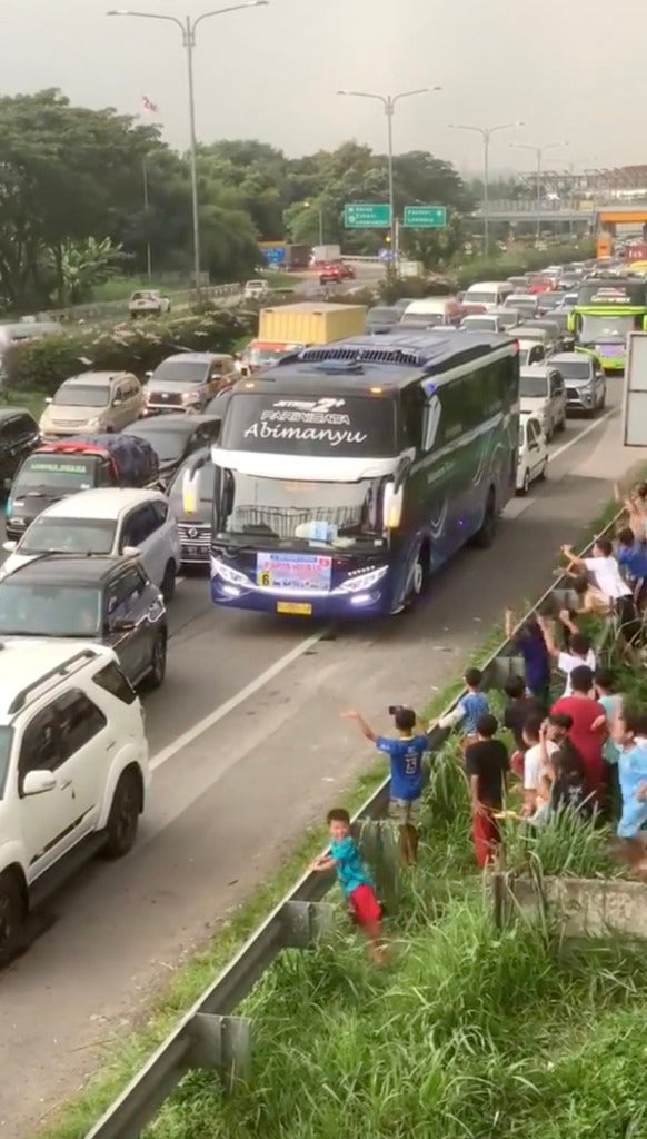 Indonesian Kids Waiting by Roadside Dance in Joy After Hearing Bus ...