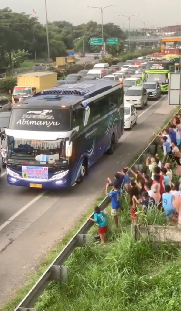 Indonesian Kids Waiting by Roadside Dance in Joy After Hearing Bus ...