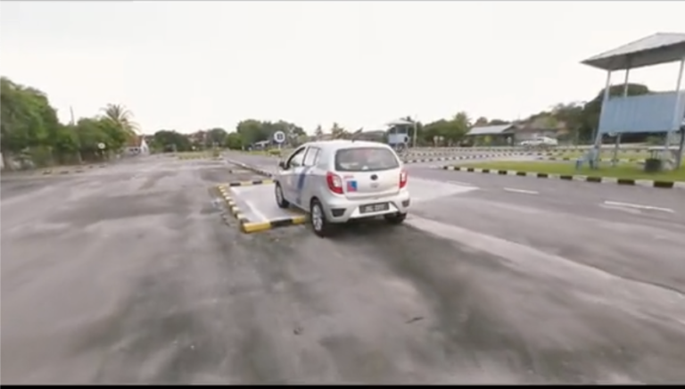 M'sian Driving Student Goes Viral for Just Running Over Traffic Barrier During Parallel Parking ...
