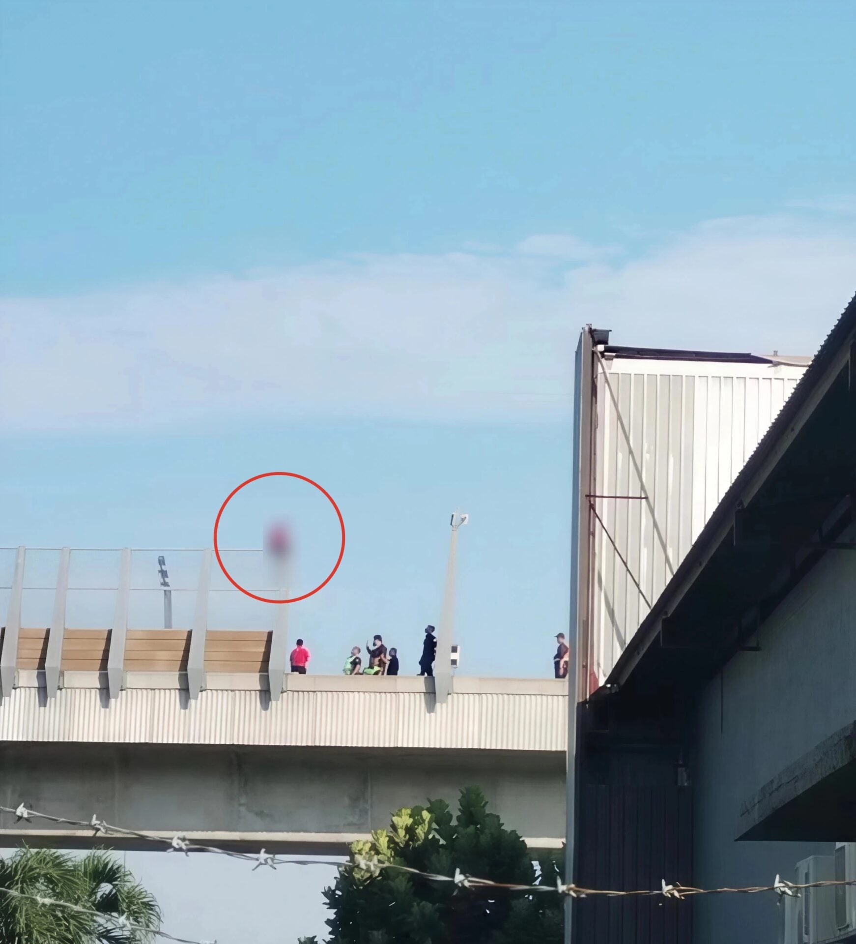 Man Trespasses Onto Elevated MRT Track & Sits Precariously on Barrier ...
